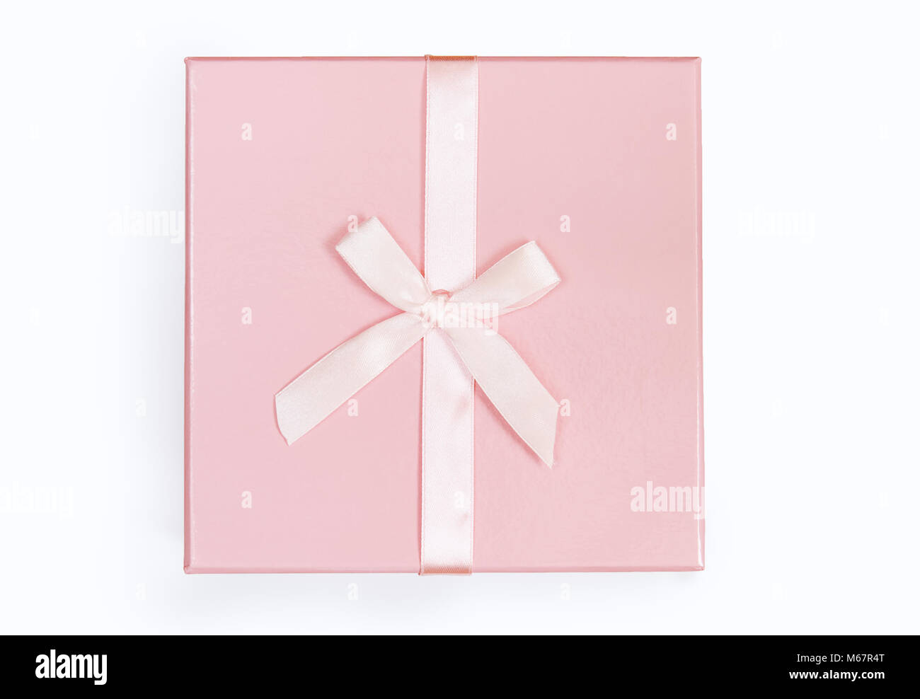 Pink gift box with ribbon and bow isolated on white background. Top ...