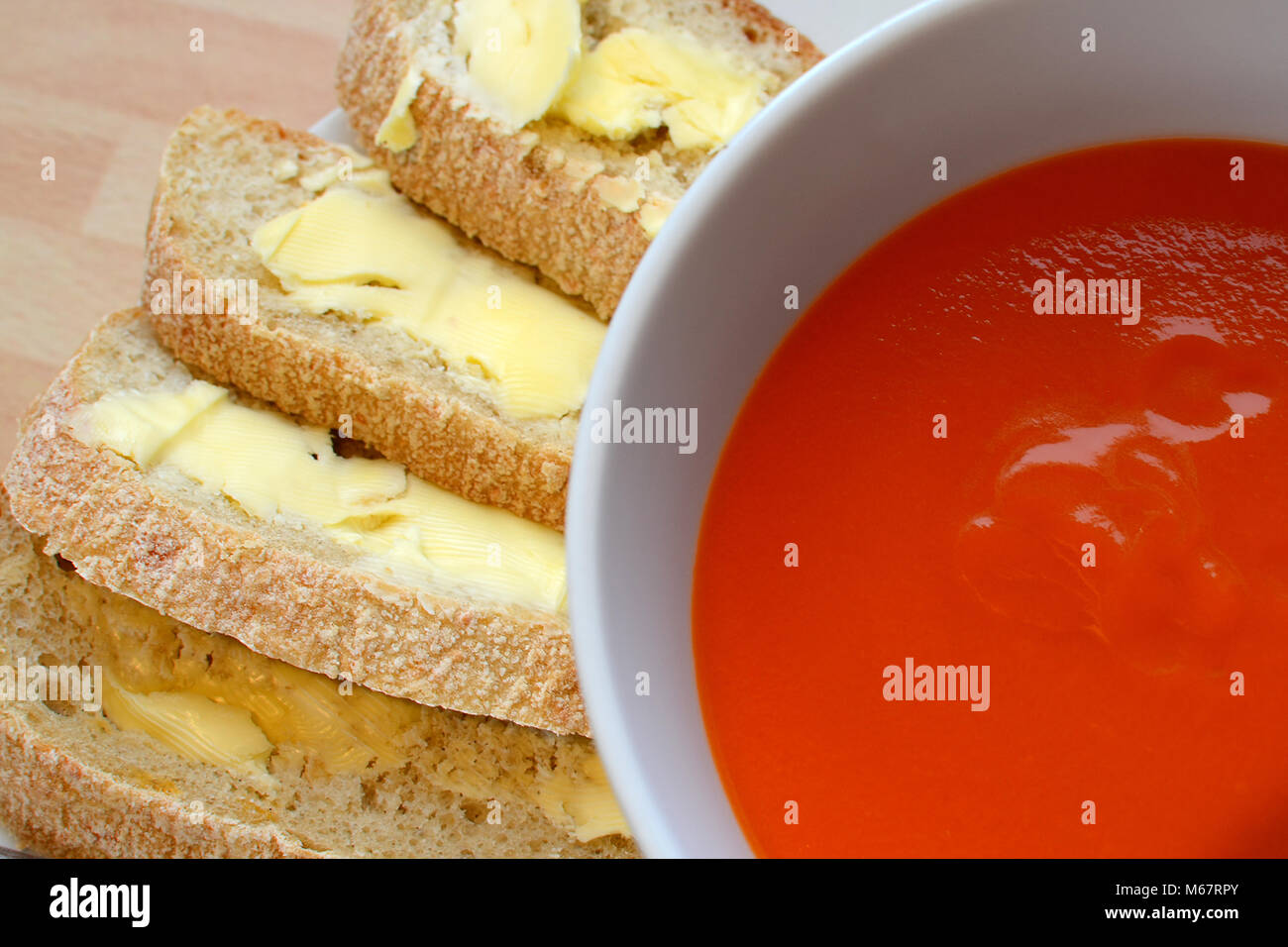 tomato soup with rustic bread Stock Photo - Alamy