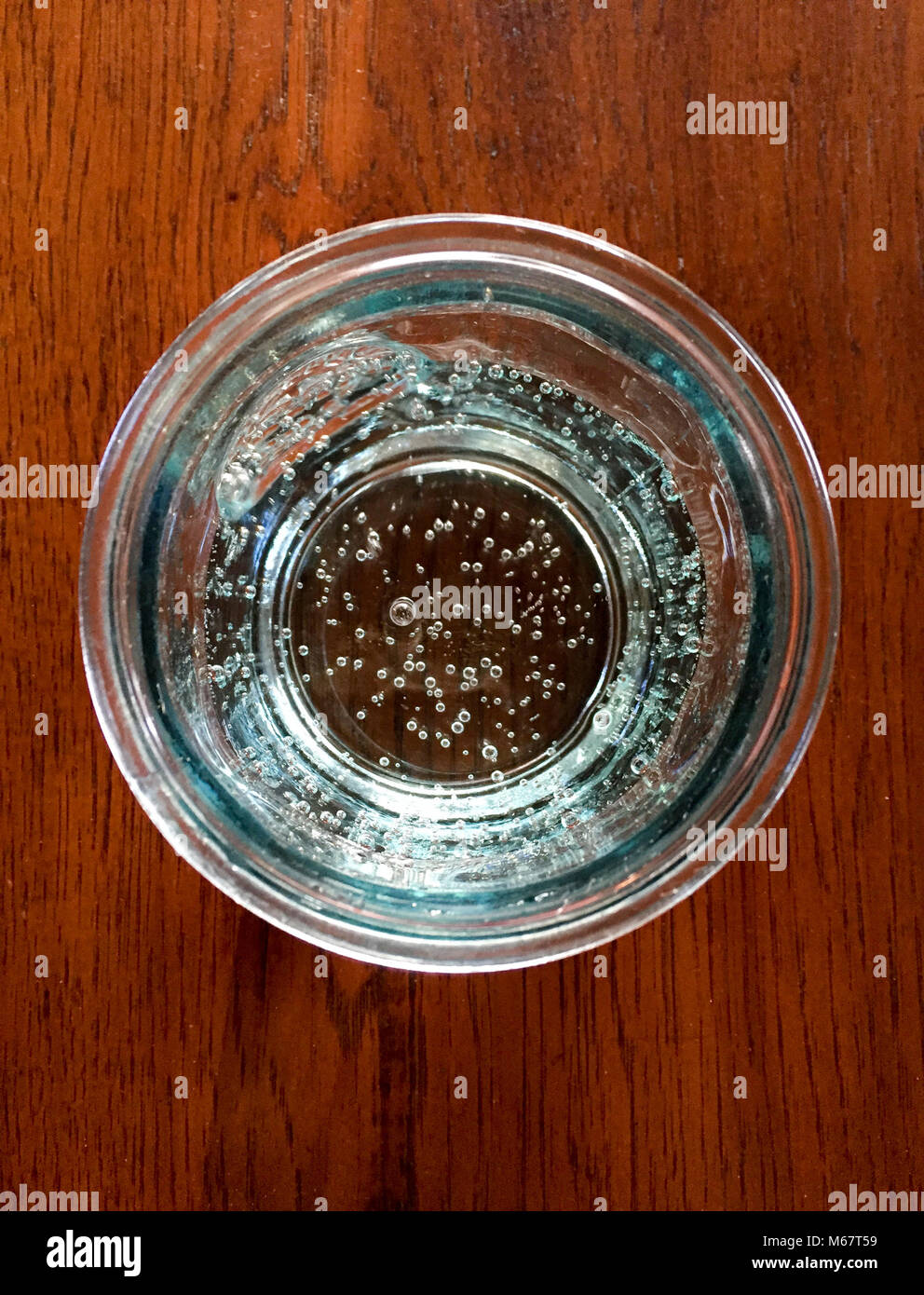 Top view of glass with bubbles from sparkling water Stock Photo - Alamy