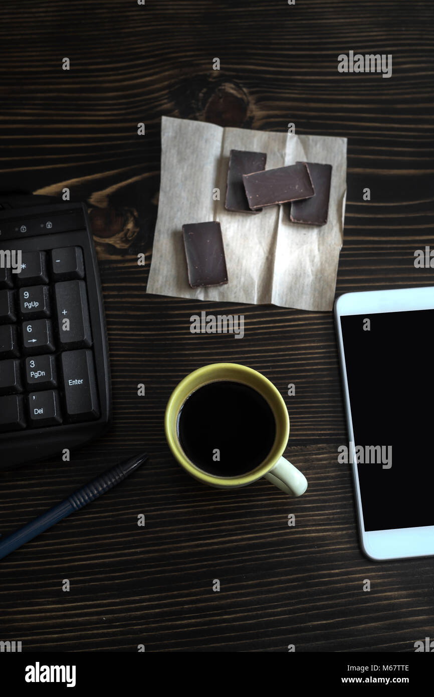 Working office desk in dark colors Stock Photo - Alamy