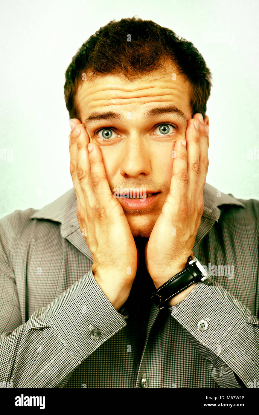 Worried young man face looking scared and anxious Stock Photo - Alamy