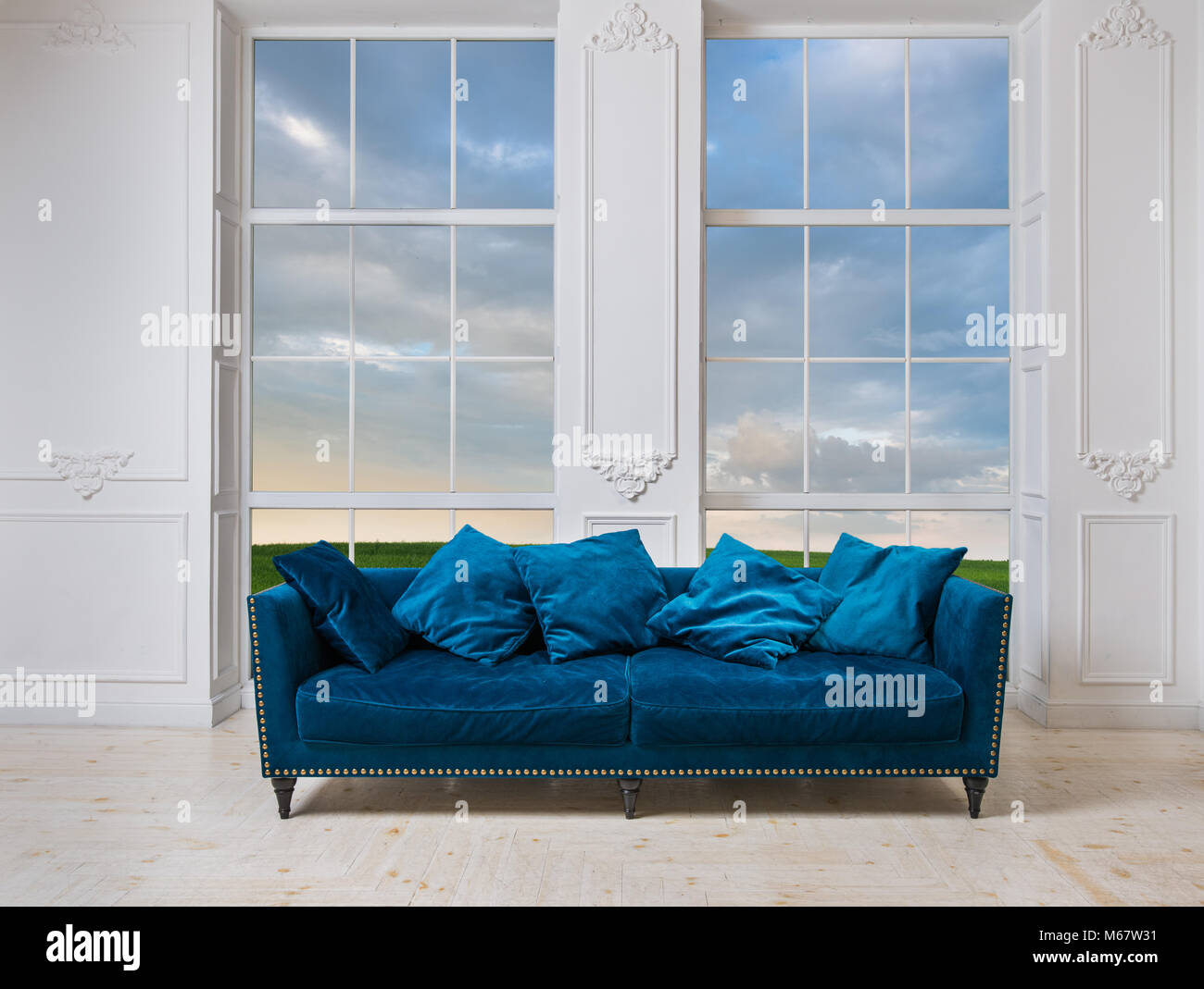 Spacious white living room with scenic window view Stock Photo - Alamy