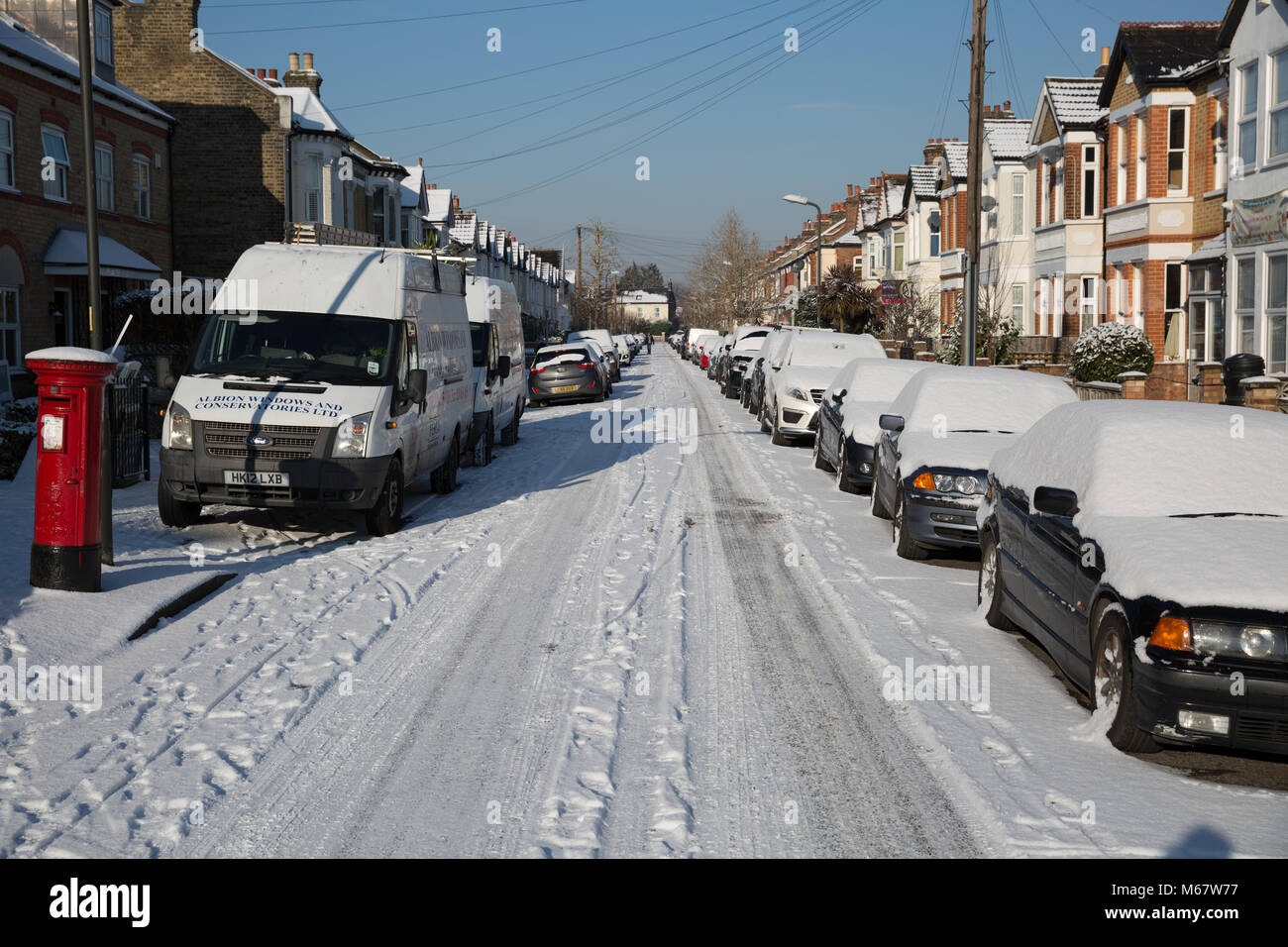 Street covered with snow Stock Photo - Alamy