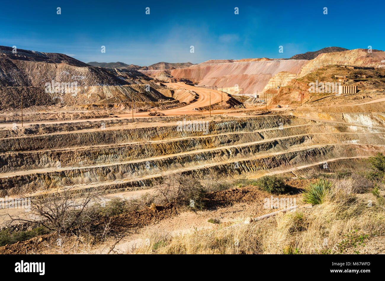 Haze after blast over mining benches at open-pit Morenci Copper Mine ...