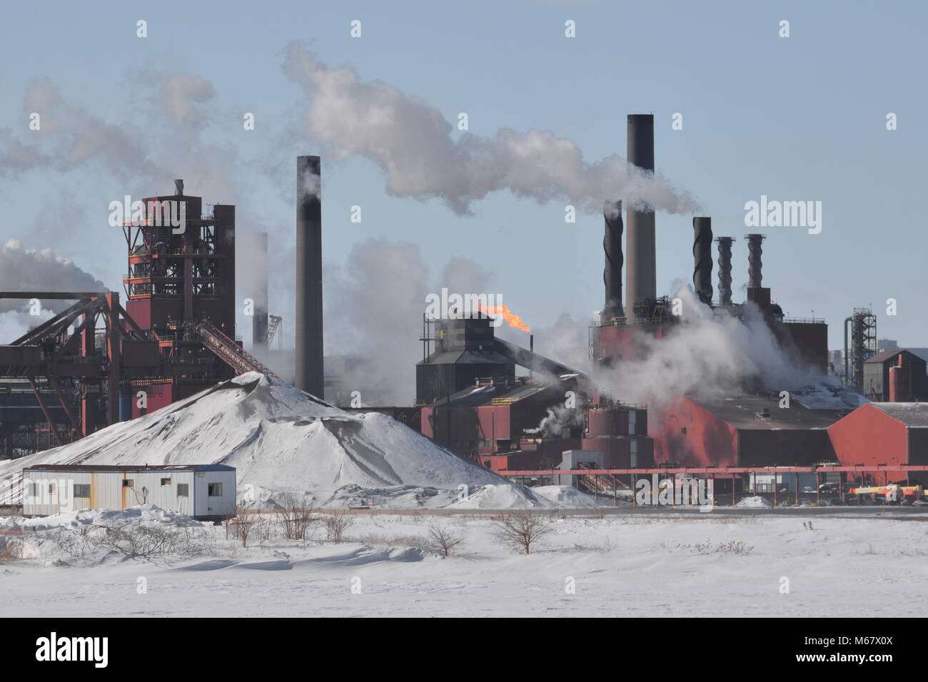 The steel mills viewed across a frozen Hamilton Harbour, Ontario ...