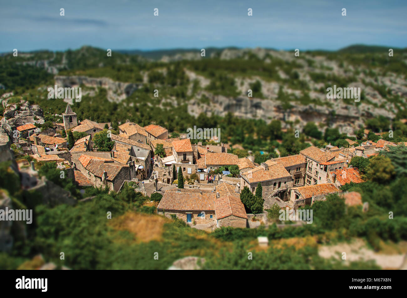 View of the Baux-de-Provence castle ruins on the hill, with roofs of ...