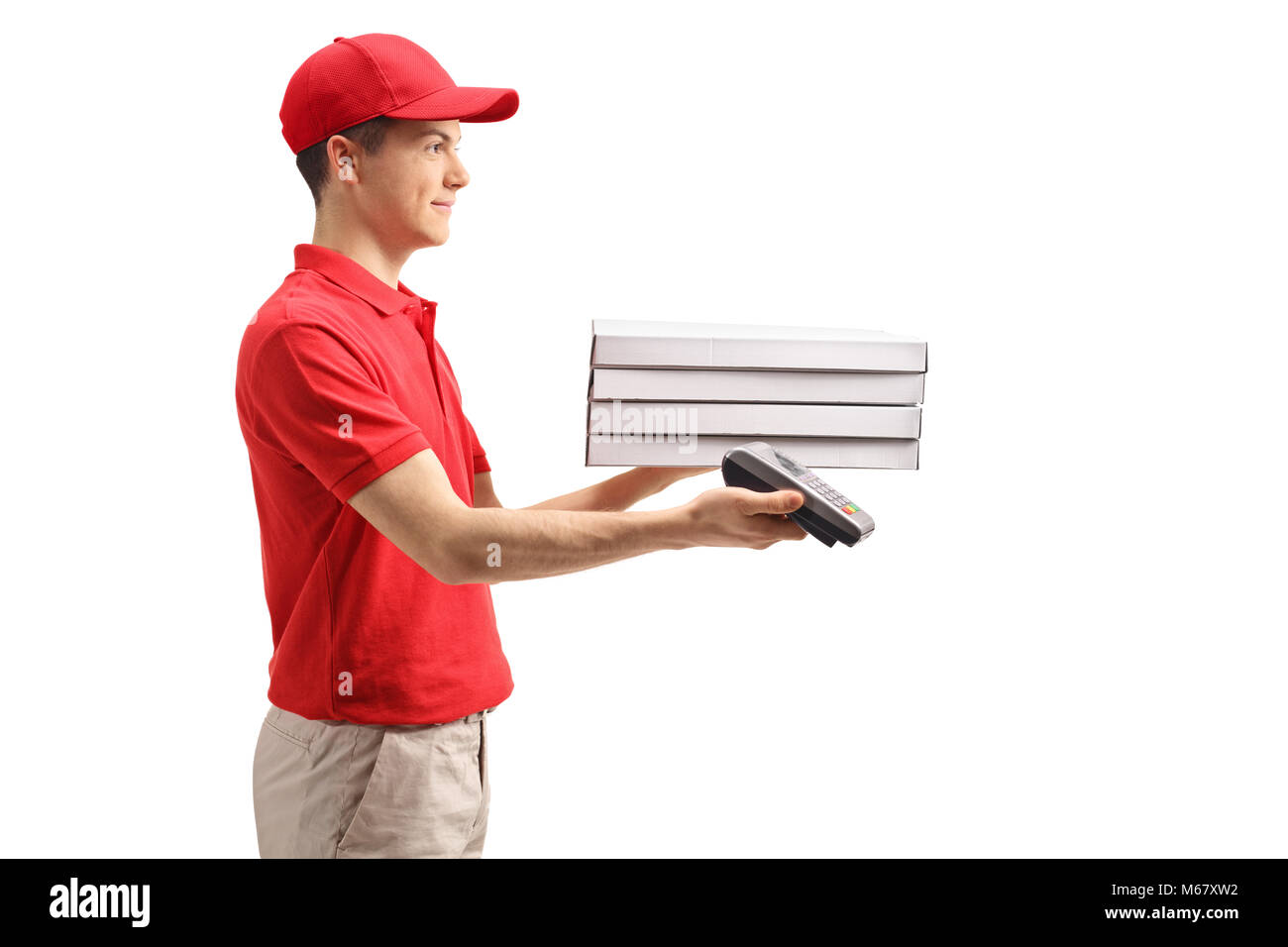 Teenage delivery boy holding pizza boxes and a payment terminal ...