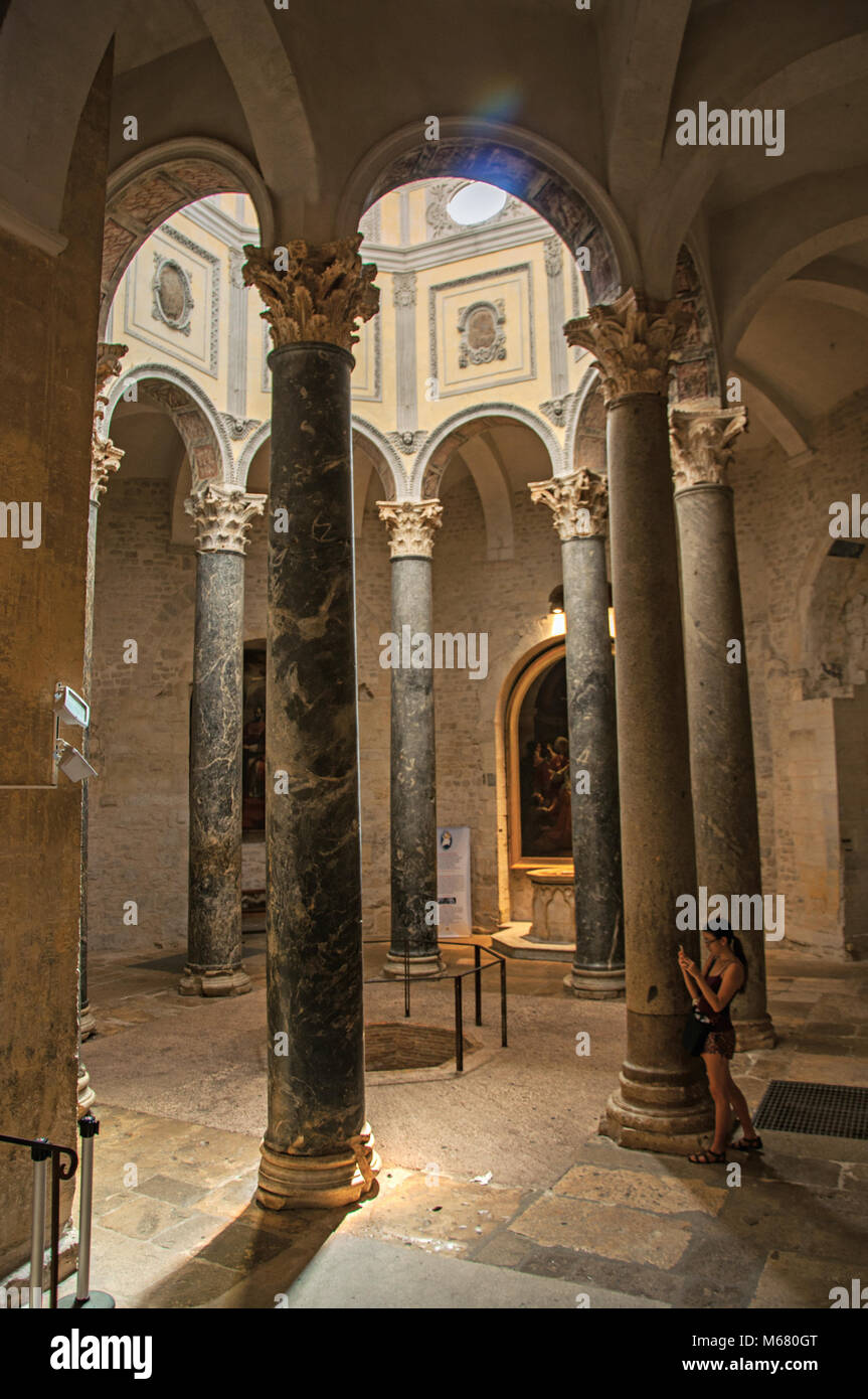 Aix Cathedral with woman amid columns and light from above in Aix-en ...