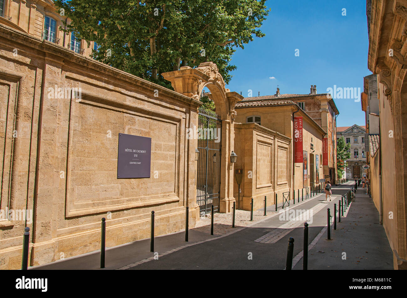 Alley with buildings and gate in Aix-en-Provence, a lively town in the ...