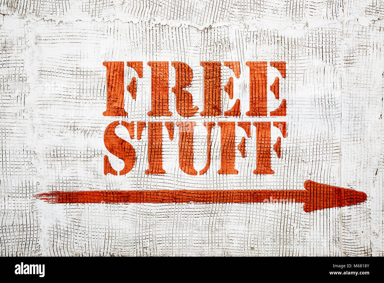free stuff - red graffiti sign with arrow on a white stucco wall Stock ...