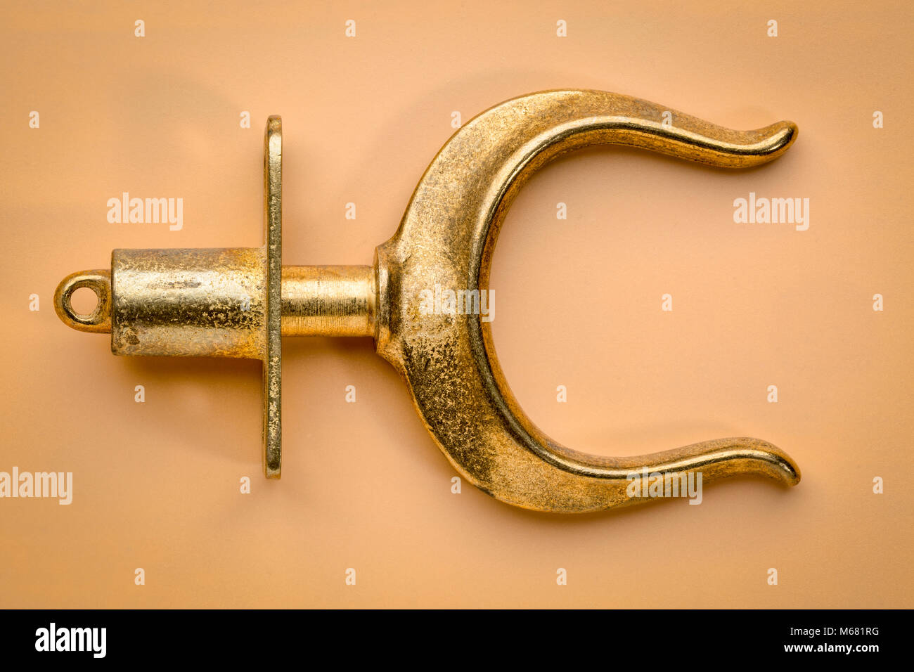 brass rowlocks (oarlock) on beige background Stock Photo - Alamy