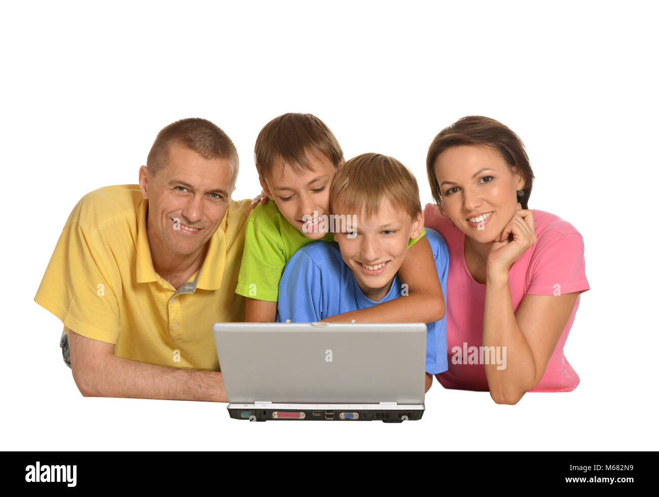 Parents with sons using laptop Stock Photo - Alamy