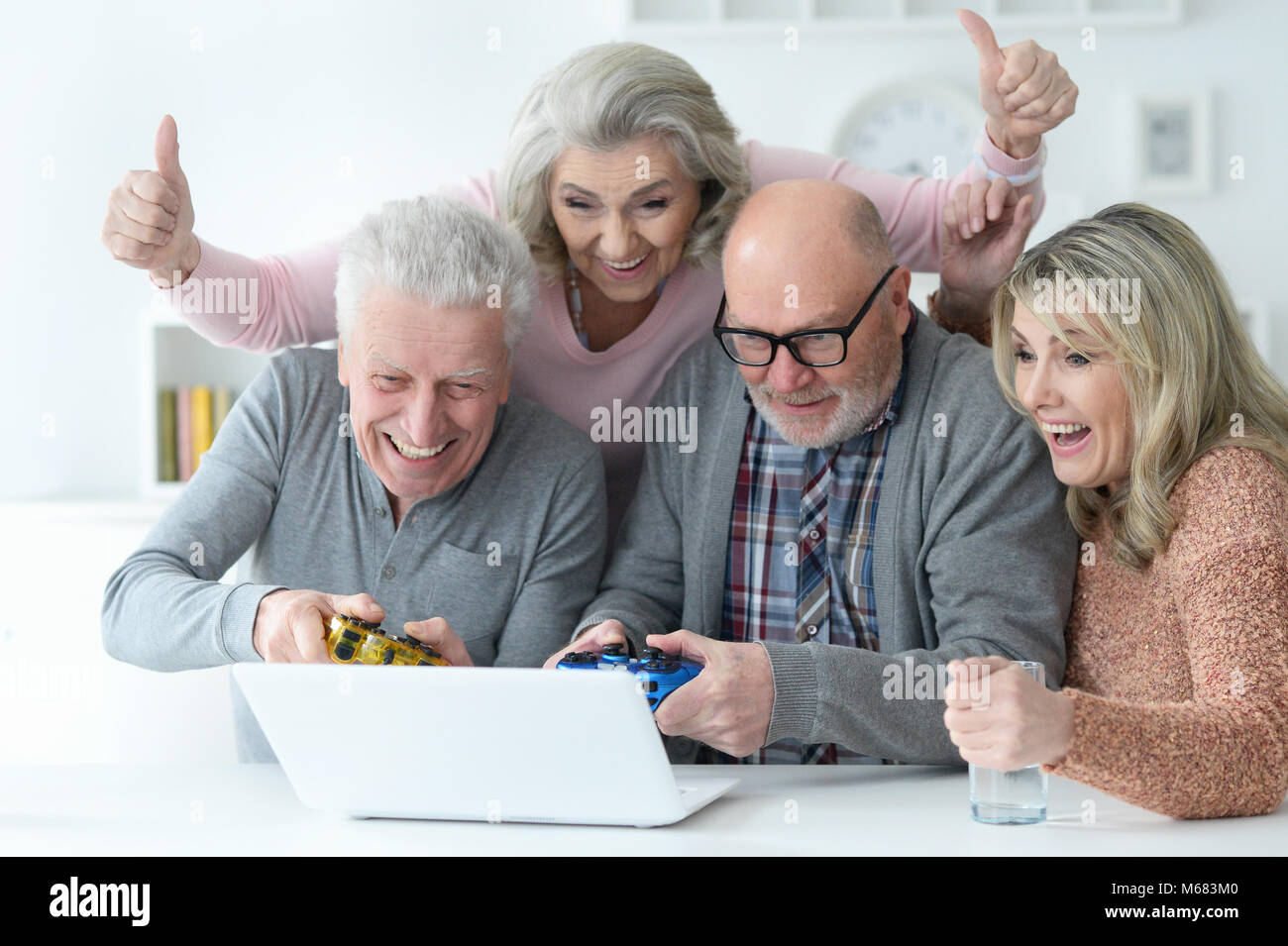 senior couples playing computer game Stock Photo - Alamy