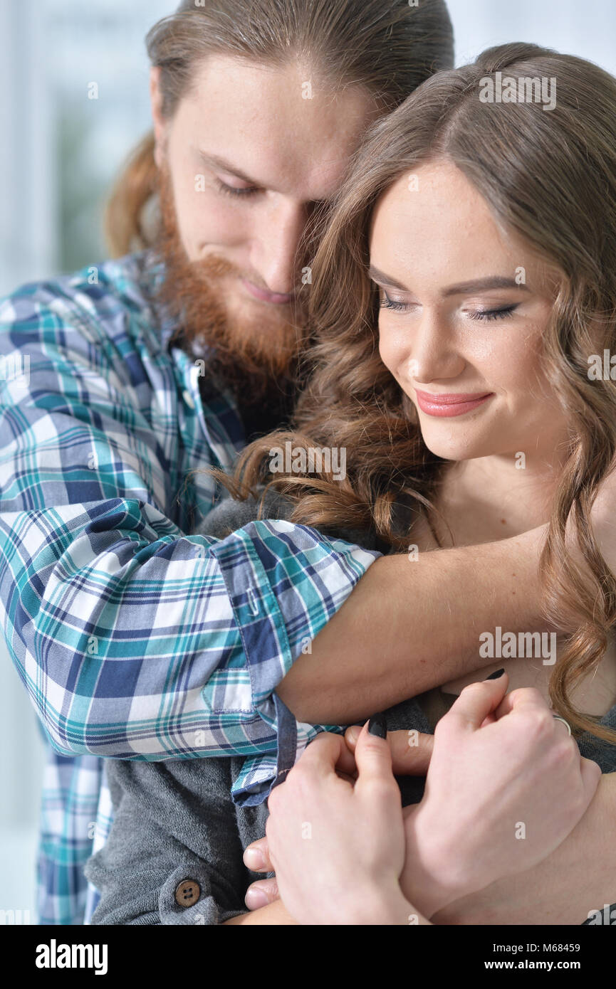 beautiful young couple hugging Stock Photo - Alamy