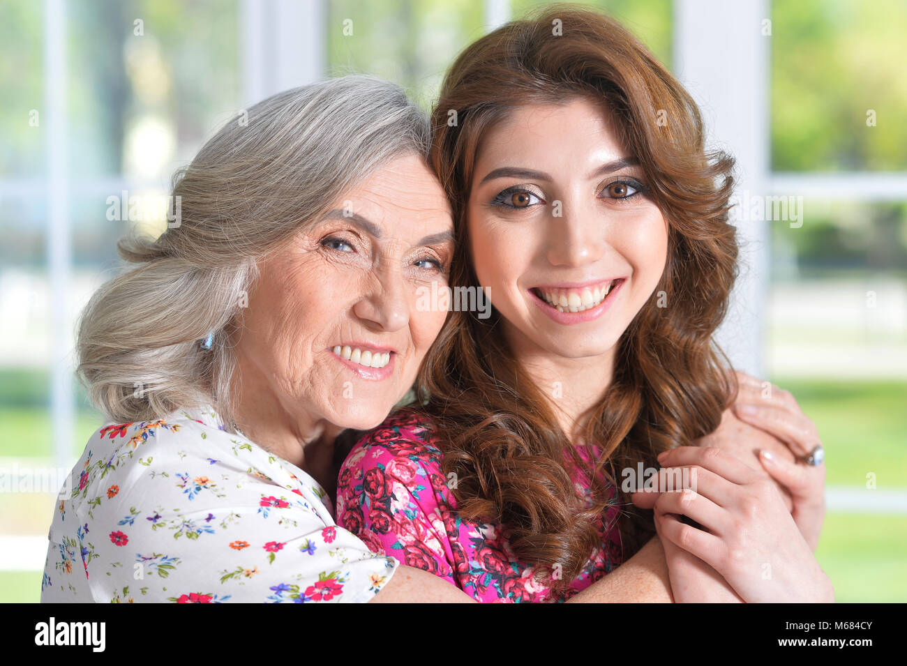 woman hugging daughter Stock Photo - Alamy