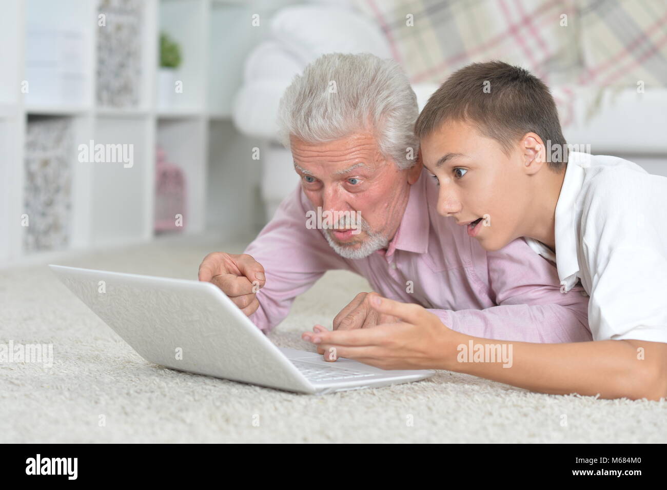 grandfather and grandson using laptop Stock Photo - Alamy