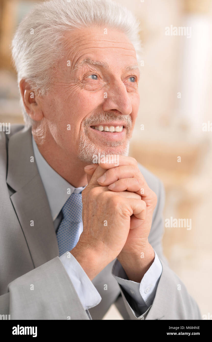 senior man thinking indoors Stock Photo - Alamy