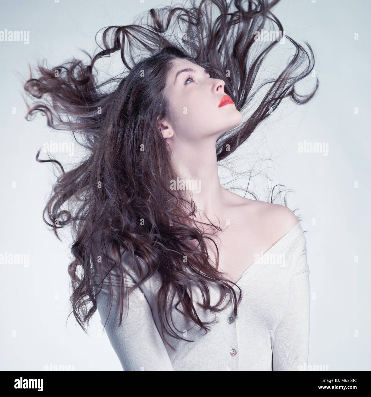 Photo of young beautiful woman with magnificent hair Stock Photo - Alamy