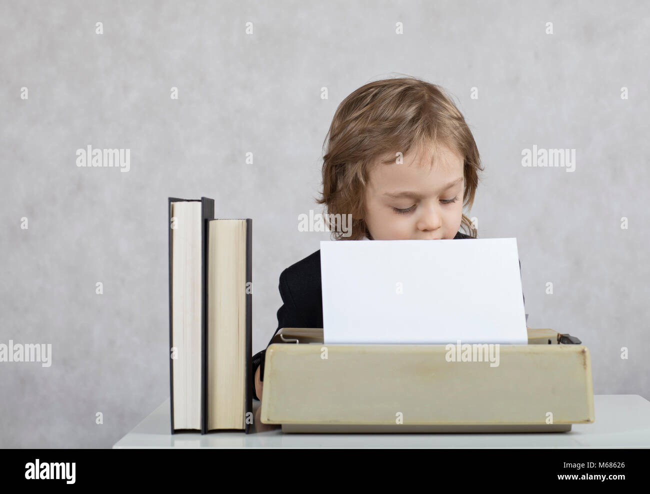 Boy typewriter typing hi-res stock photography and images - Alamy
