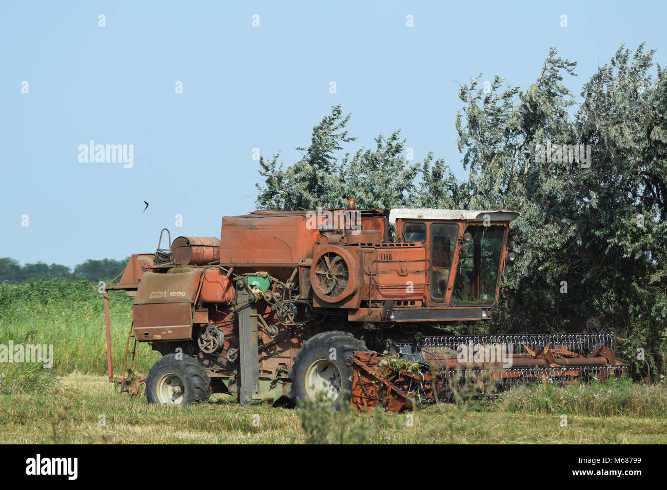 Poltavskaya village, Russia - September 6 2017: Old rusty combine ...