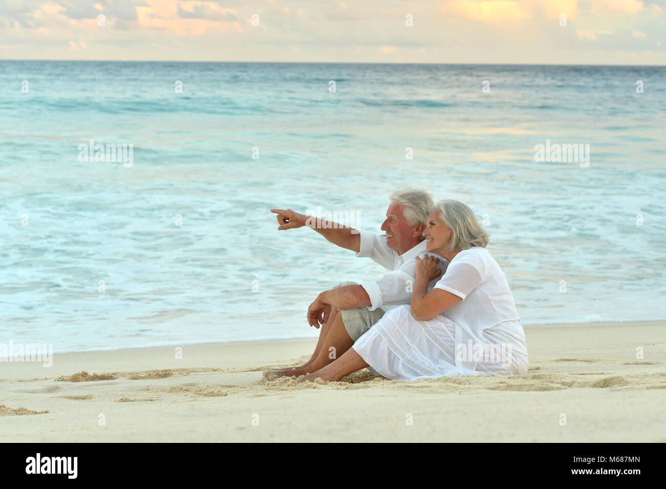 elderly couple rest at tropical resort Stock Photo - Alamy
