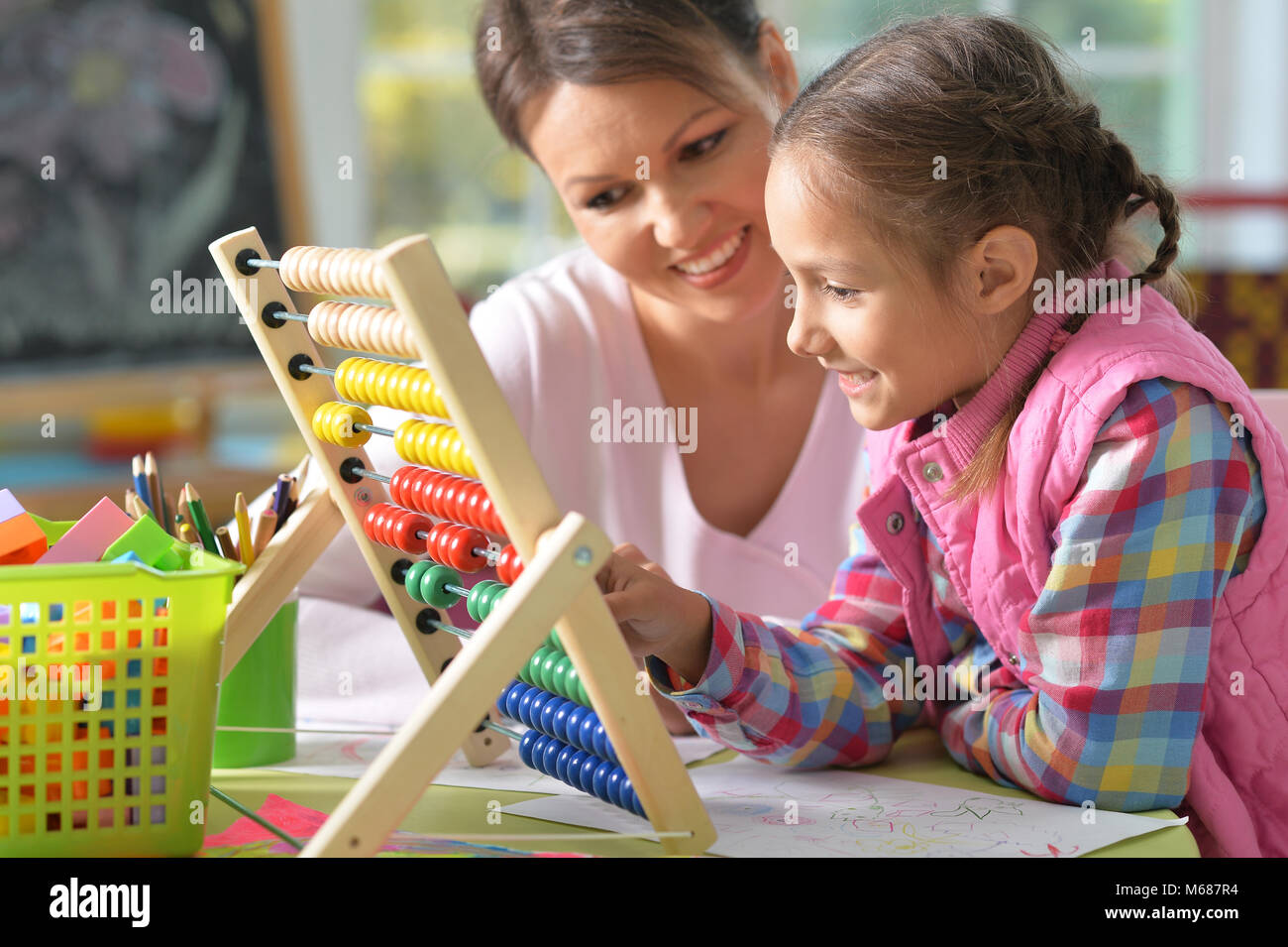 mother and daughter doing homework Stock Photo - Alamy