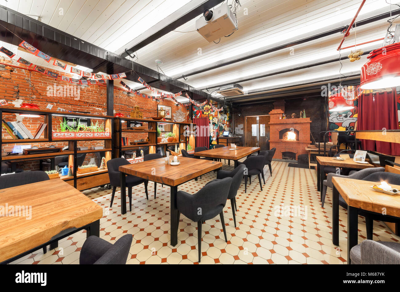 Interior of the Russian farm restaurant "LAVKALAVKA". The main hall ...