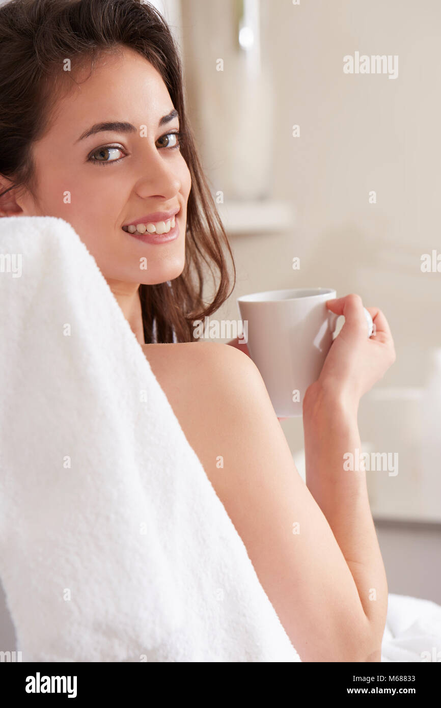brunette drink a cup of tea at spa salon Stock Photo - Alamy