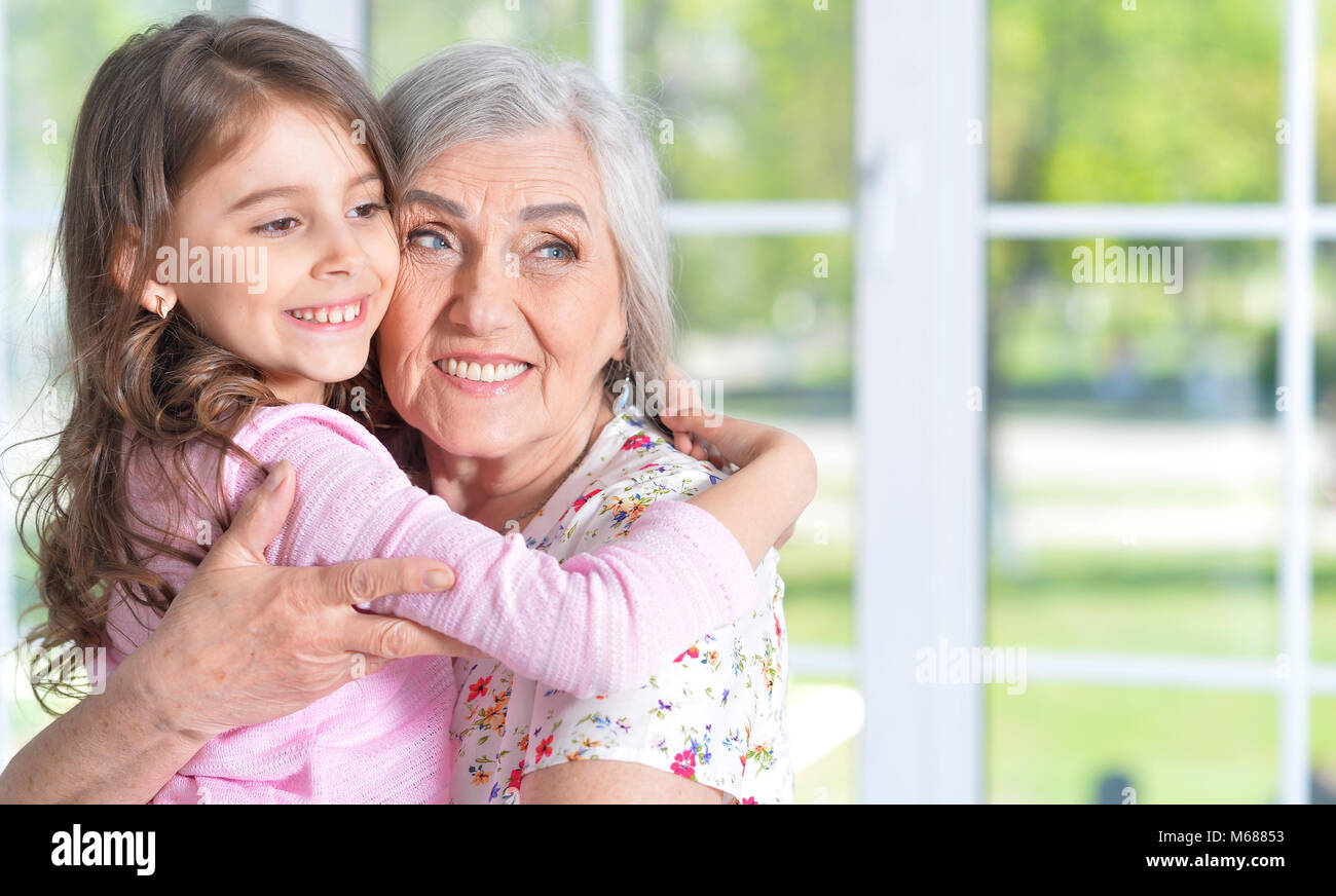 little girl hugging grandmother Stock Photo - Alamy
