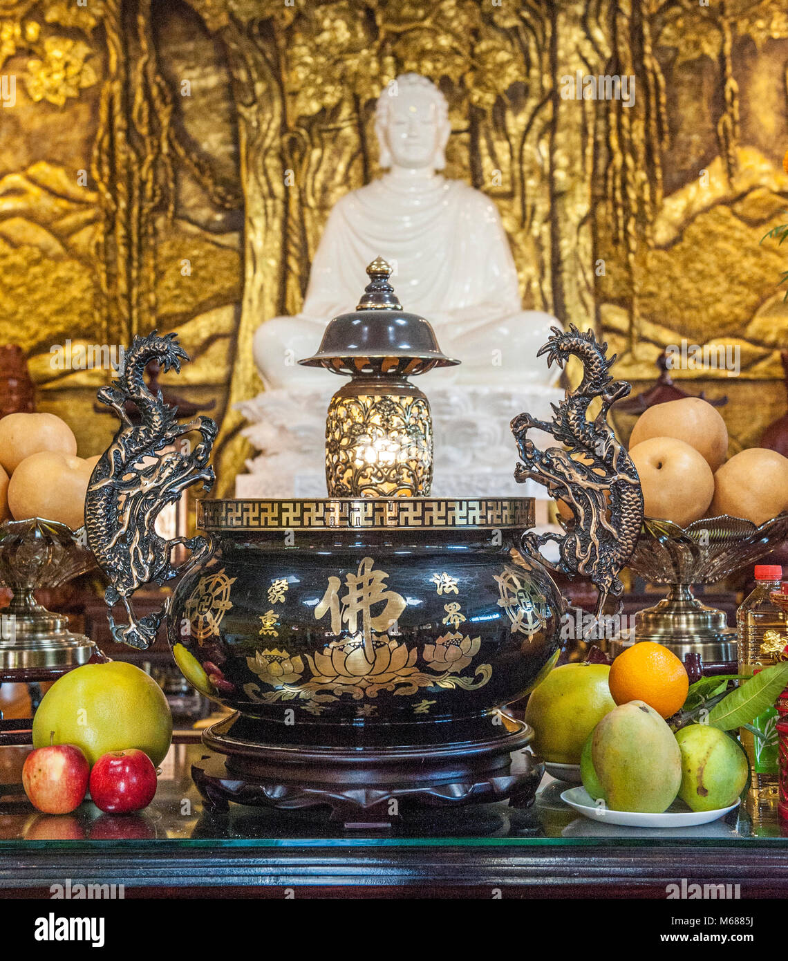 Shrine of Shakyamuni Buddha with fruit offerings for Lunar New Year ...