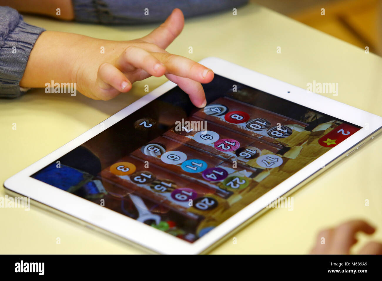 Nursery school: little girl, pupil, using a digital tablet (iPad Stock ...