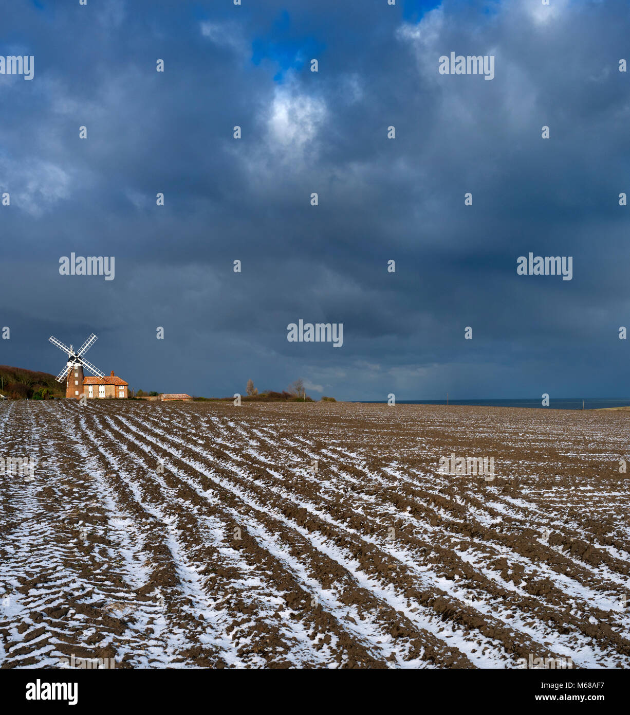 Windmill and winter plough Weybourne on the north Norfolk coast Stock ...