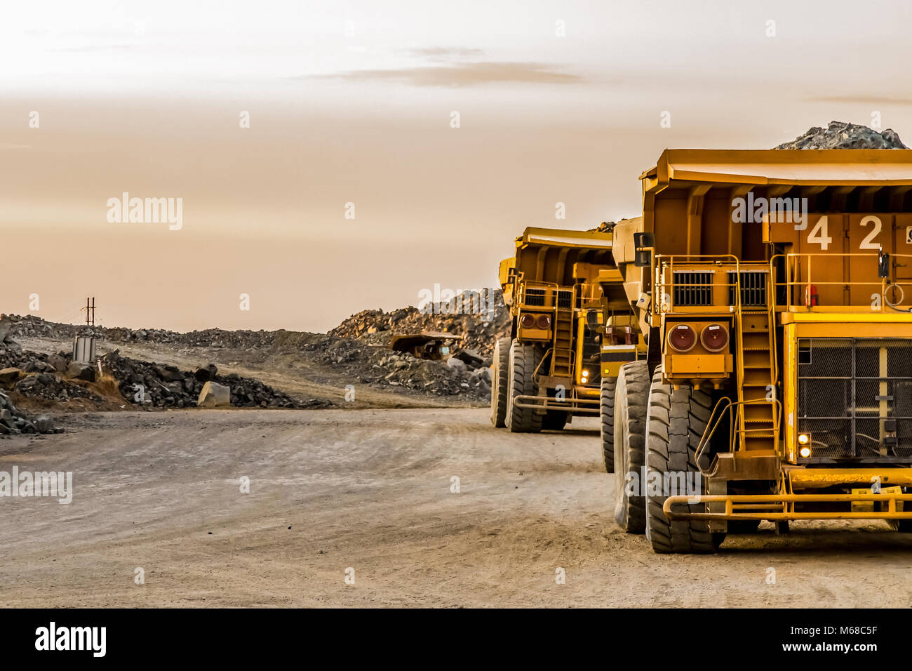 Large Dump Trucks transporting Platinum ore for processing Stock Photo ...