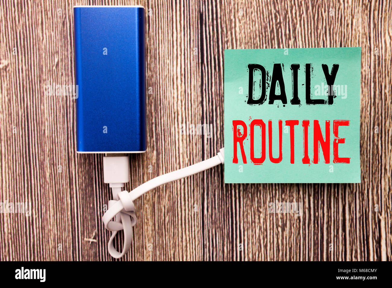 Handwritten text caption showing Daily Routine. Business concept ...