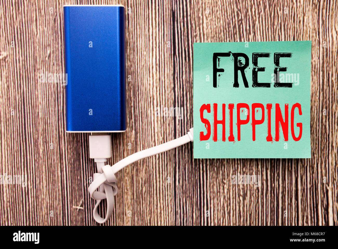 Handwritten text caption showing Free Shipping. Business concept ...