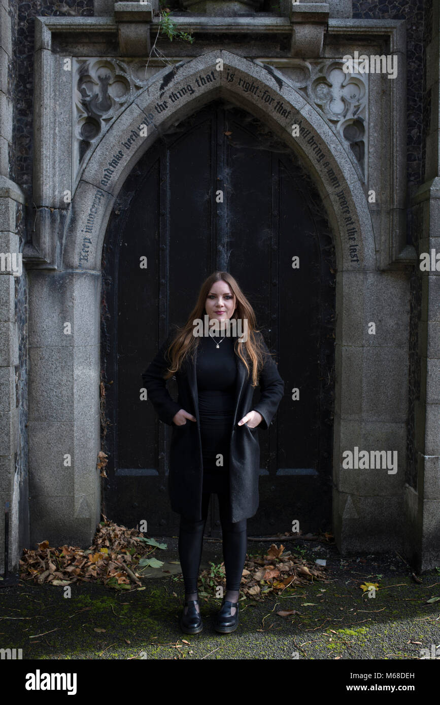 a female funeral director stands in a brighton gothic victorian ...