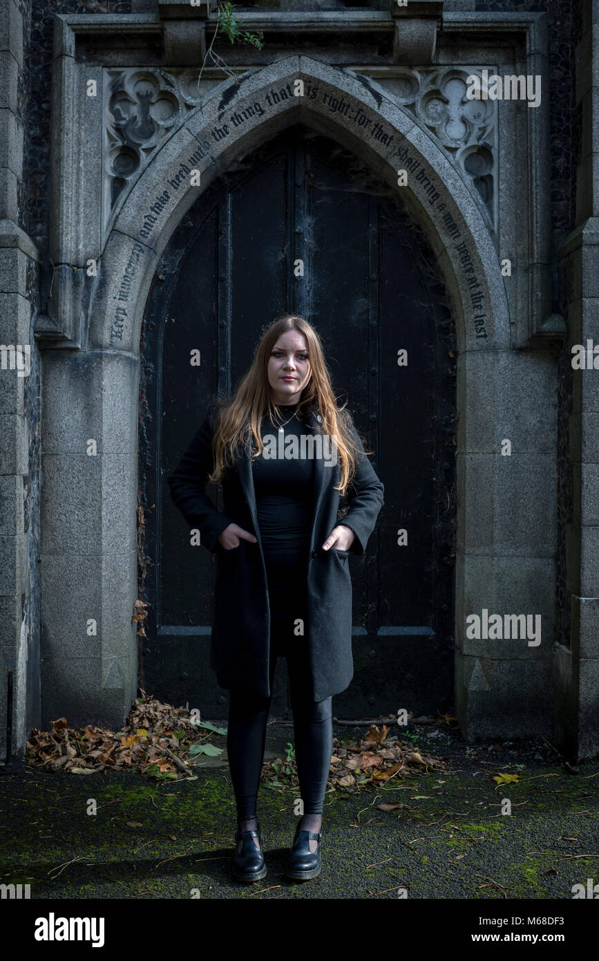 a female funeral director stands in a brighton gothic victorian ...