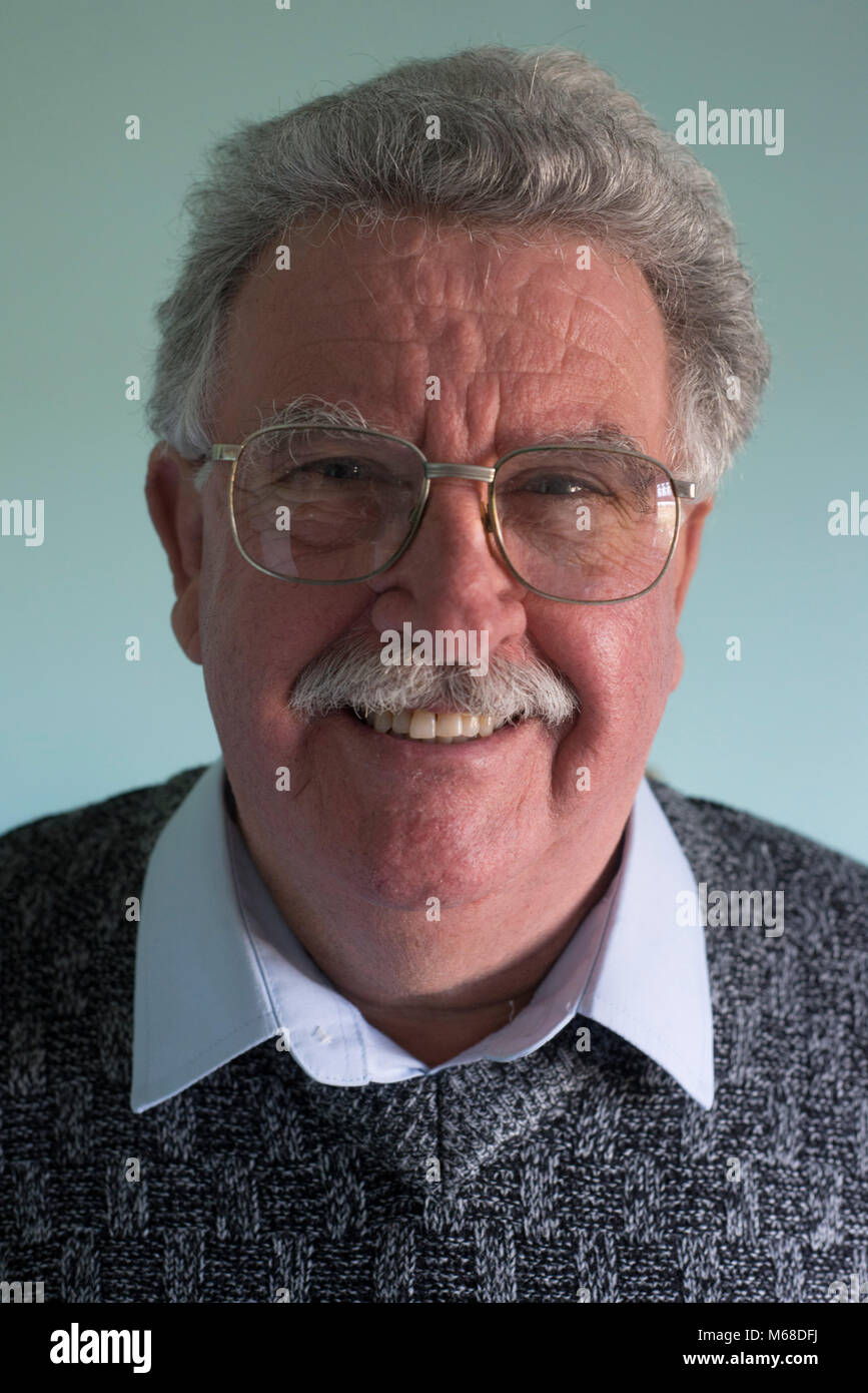 head shot of a friendly approachable white elder retired man with a ...