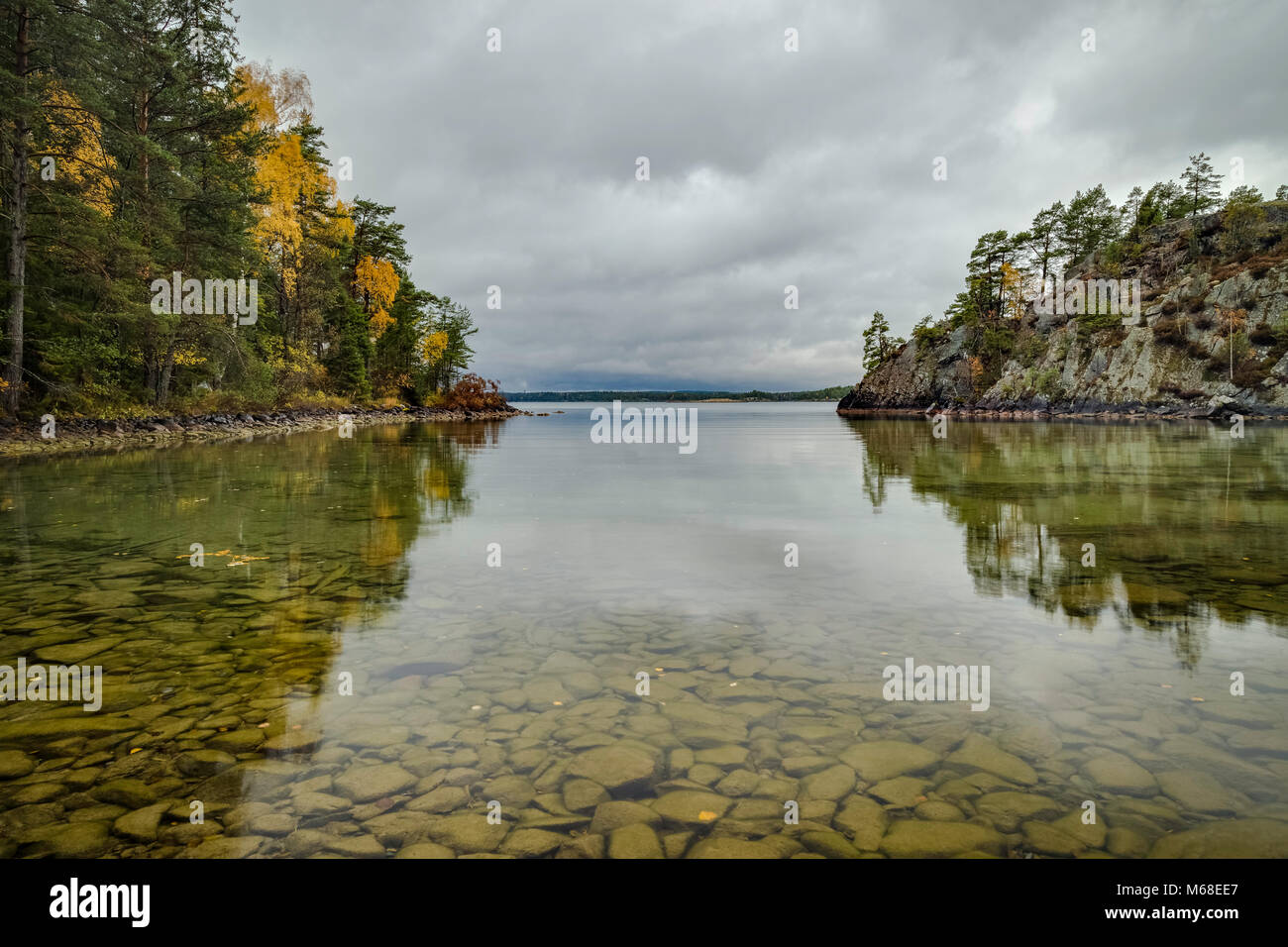 autumn view of a bay with rocks and forests Stock Photo - Alamy