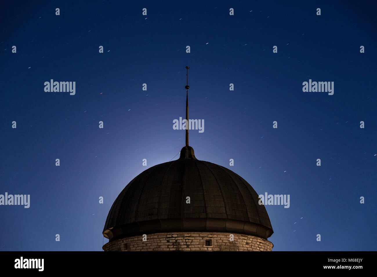 a tower in a castle with the moon shining from behind Stock Photo - Alamy
