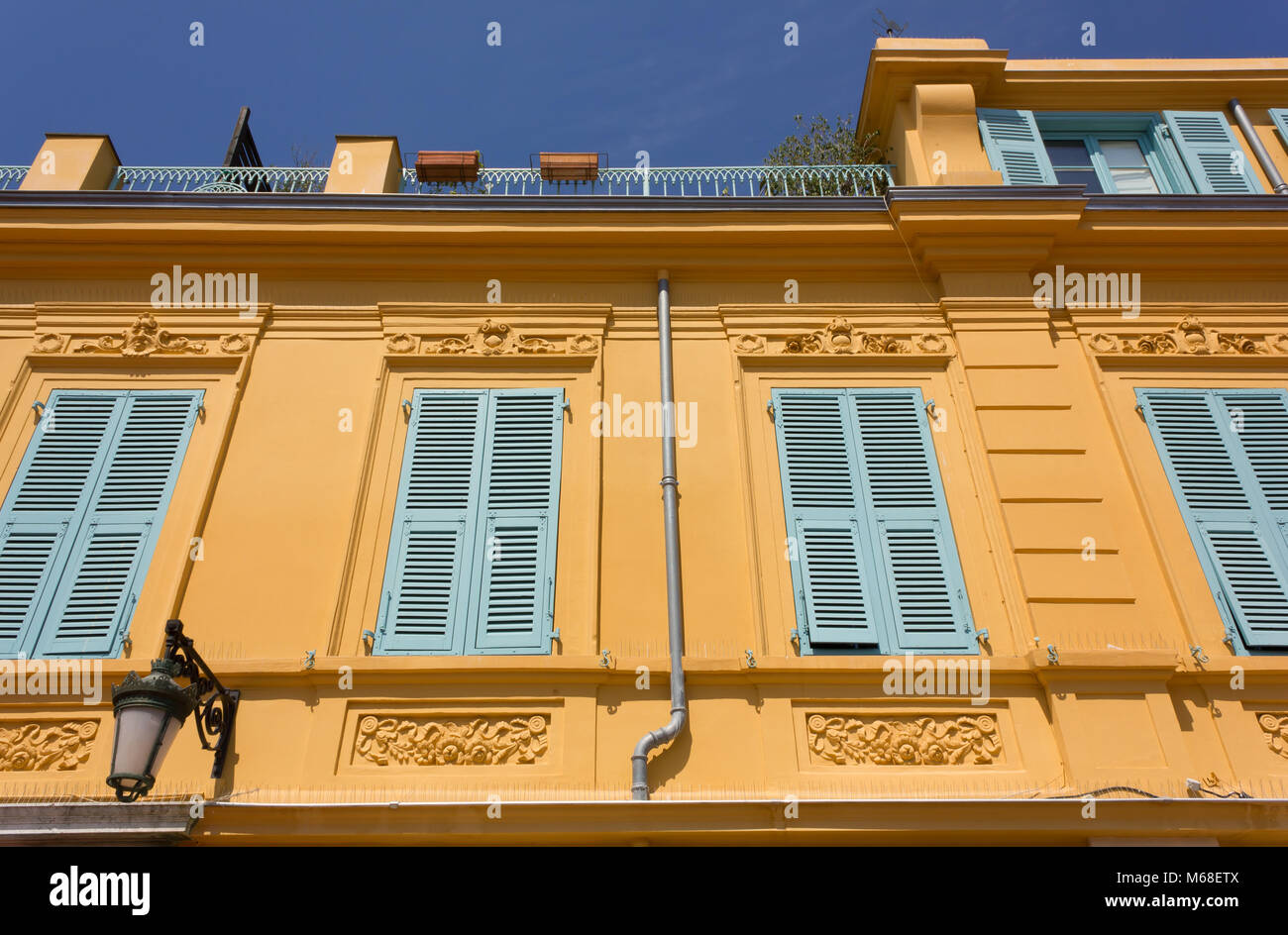 Pastel colored facade of a historic building Stock Photo - Alamy