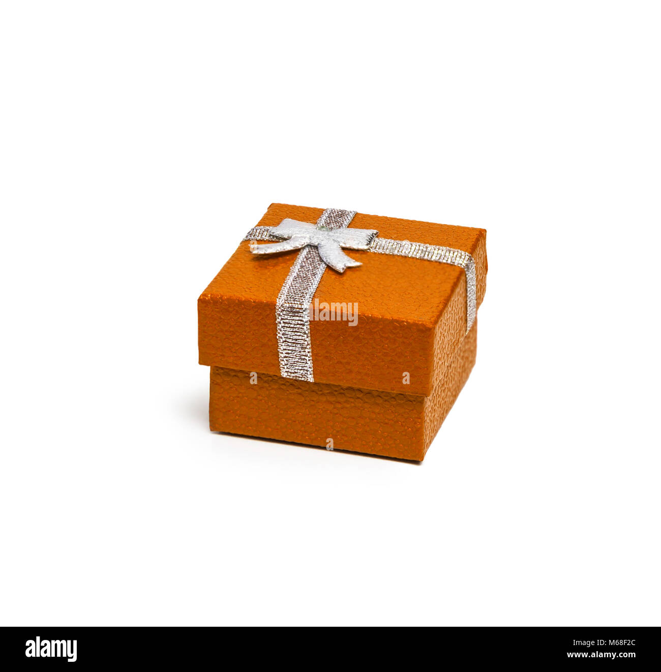 Orange color gift box with silver ribbon isolated on white background ...