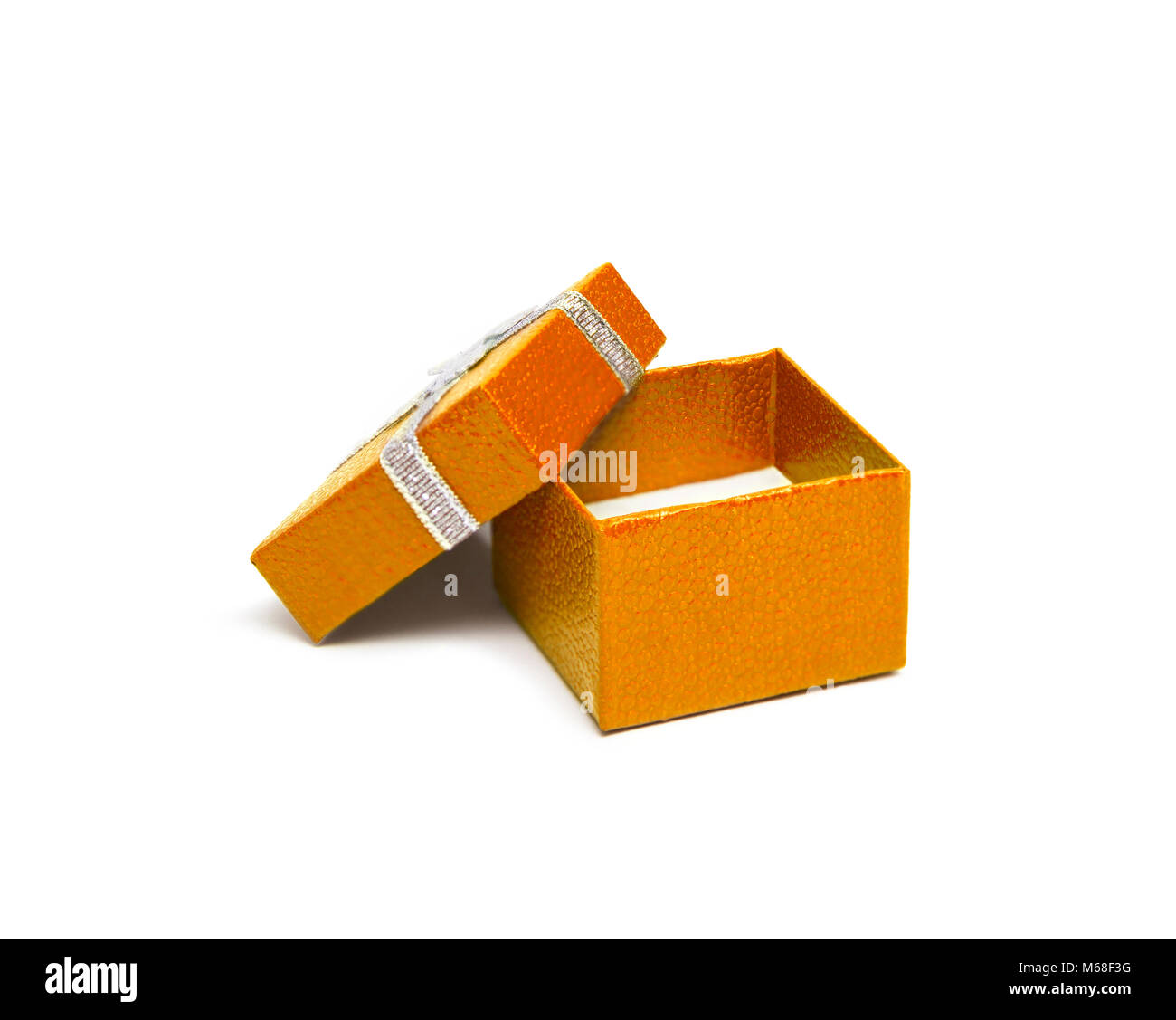Open Orange color gift box with silver ribbon isolated on white ...