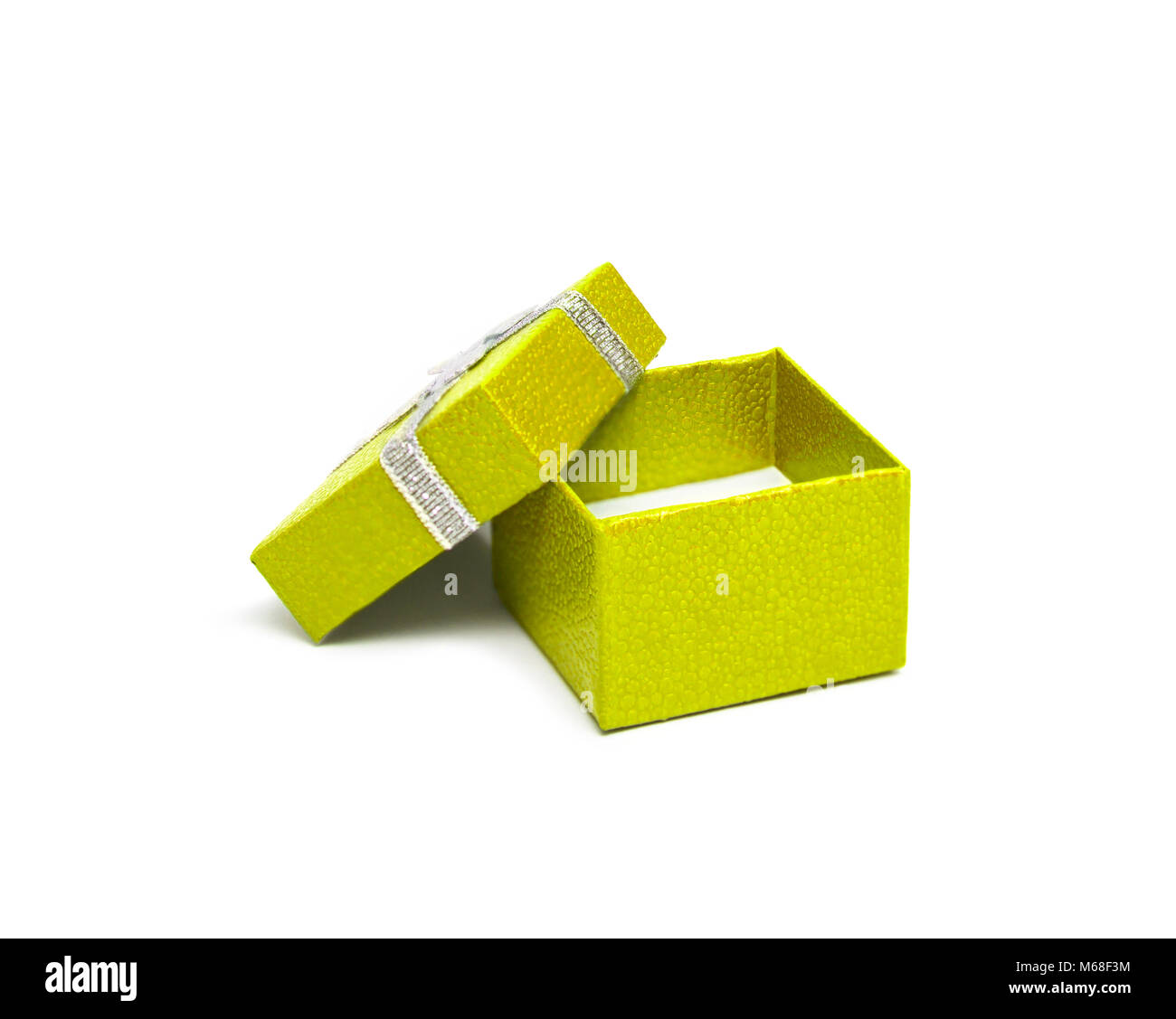Open Yellow color gift box with silver ribbon isolated on white ...