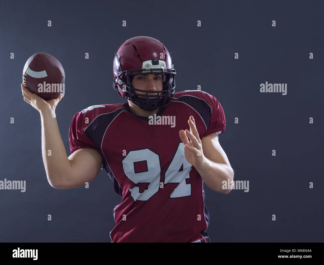 one quarterback american football player throwing ball isolated on gray ...