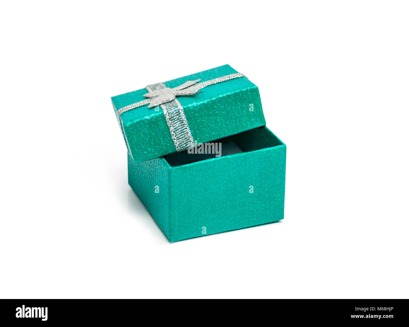 Open Tea color gift box with silver ribbon isolated on white background ...