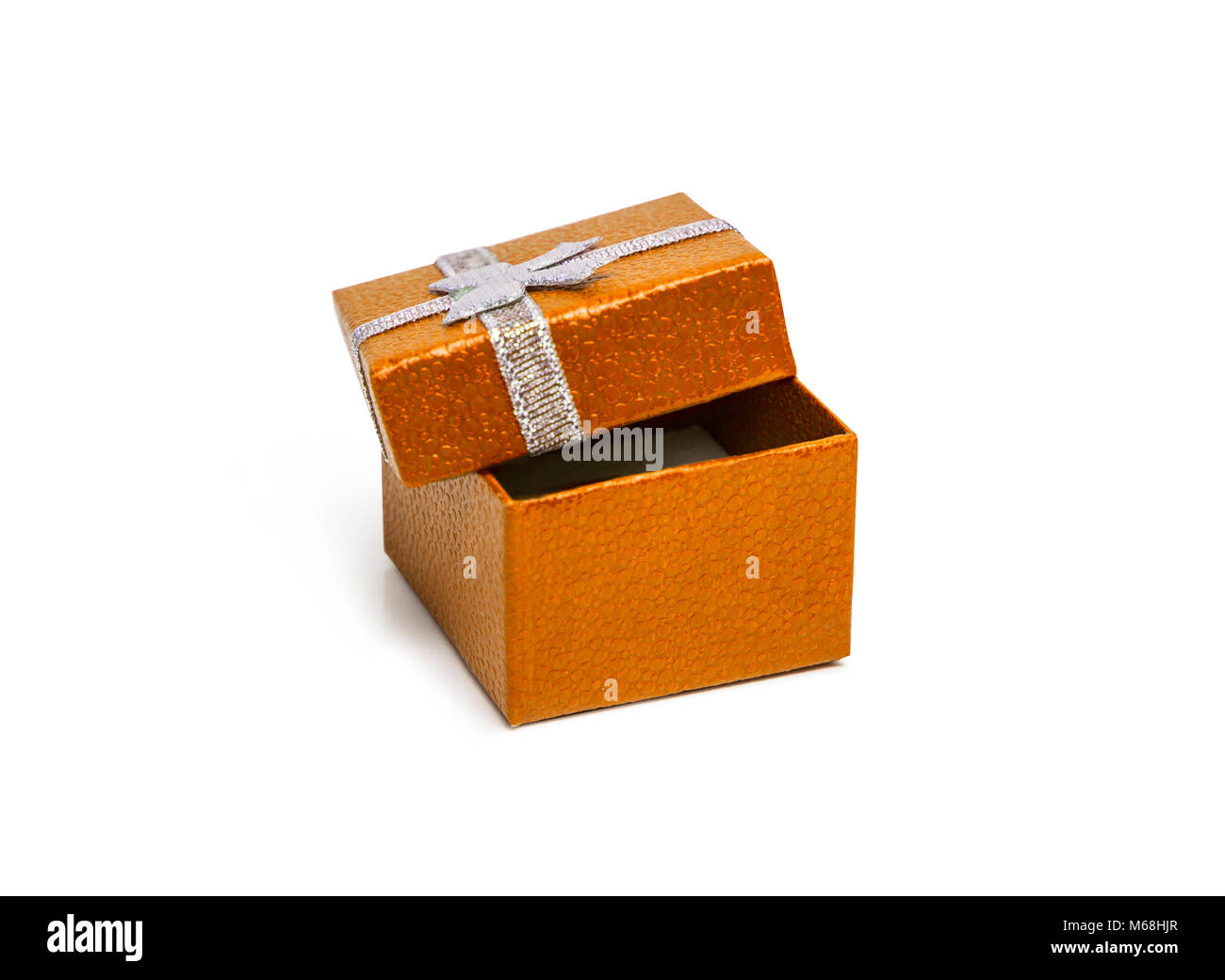 Open Orange color gift box with silver ribbon isolated on white ...