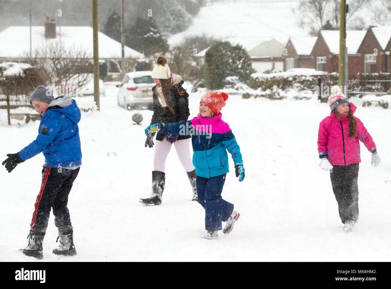 Children have a snowball fight in Yeadon, Yorkshire, as storm Emma ...