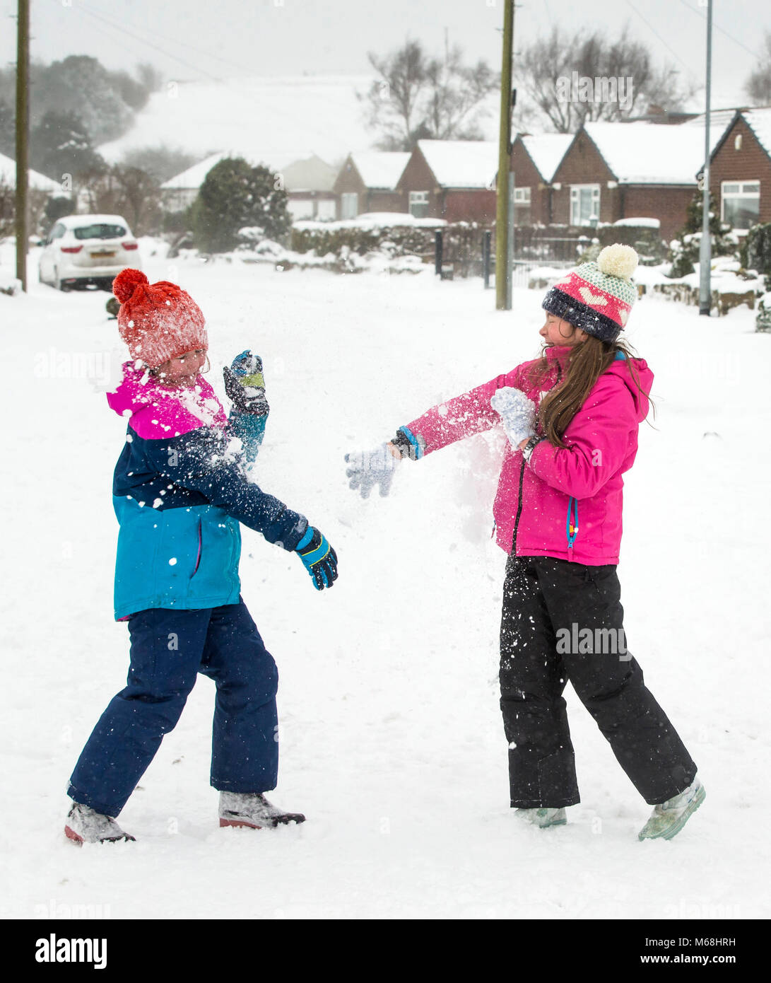 Isla Wallace (left) and Millie Johnson (right) have a snowball fight in ...