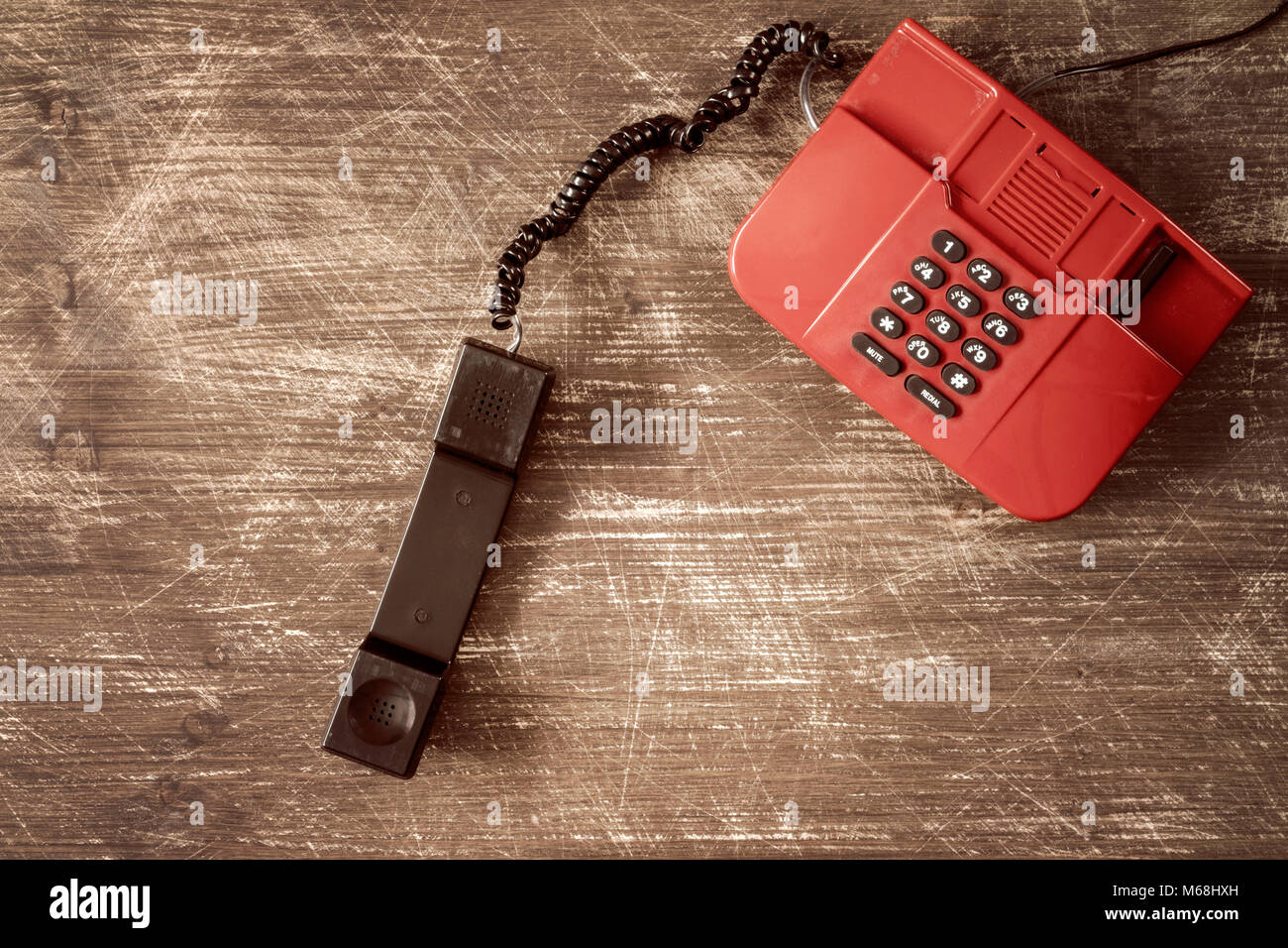 Red classic telephone on a wooden table.Top view Stock Photo - Alamy